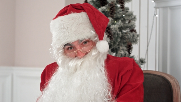 Santa Claus Answering Christmas Letters and Talking To a Camera, Stock ...
