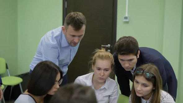 The Teacher Helping the Group of Students To Find an Idea, Stock Footage