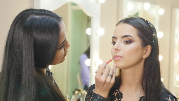 Young Woman Applying Makeup To Model in Salon, Stock Footage | VideoHive