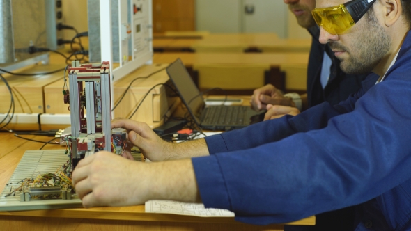 Young Engineers Working in the Laboratory and Using a Computer, Stock ...