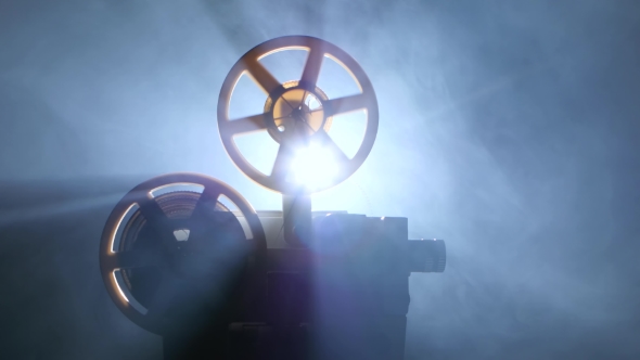 Vintage Projector Is Turned on and Running in Smoky Studio, Stock Footage