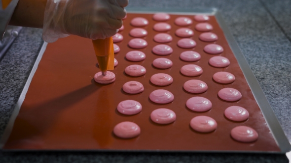 Confectioner with Pastry Syringe Does Cookies the Same Size Before ...