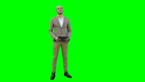 Happy Young Man Making Business Presentation on a Green Screen, Chroma ...