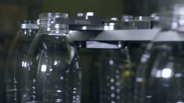 Empty Plastic Bottles Rotating in a Machine, Preparing for Use., Stock ...