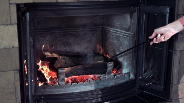 Woman Raking Up the Fire, Stock Footage | VideoHive