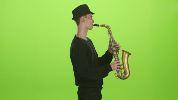 Green Screen. Saxophonist Playing on the Gold Musical Instrument, Stock ...