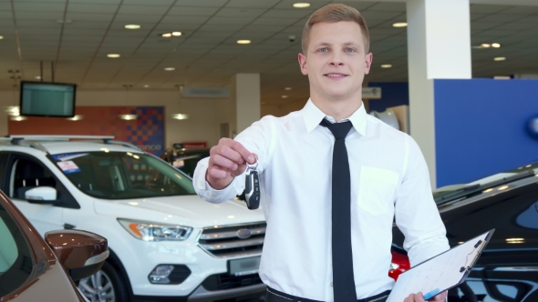 Sales Manager Shows Car Key at the Dealership, Stock Footage | VideoHive