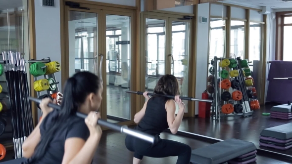 Two Women Raising Bar on Shoulders Inside Sport Gym, Stock Footage