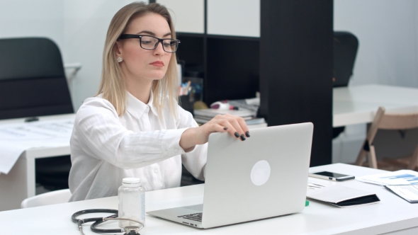 Businesswoman Typing on a Laptop Computer and Closing It, Stock Footage