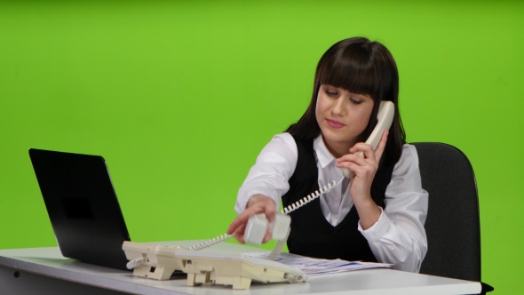 Woman Office Worker Talk on Two Phones at Once. Studio, Stock Footage
