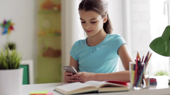 Girl with Smartphone Distracting From Homework 69, Stock Footage ...
