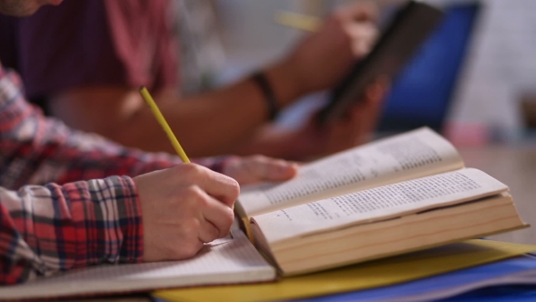 Students' Hands with Books Writing To Notebooks, Stock Footage | VideoHive