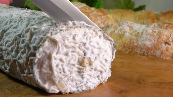 Goat Cheese with Gray Mold Is Cut with a Knife, Stock Footage | VideoHive