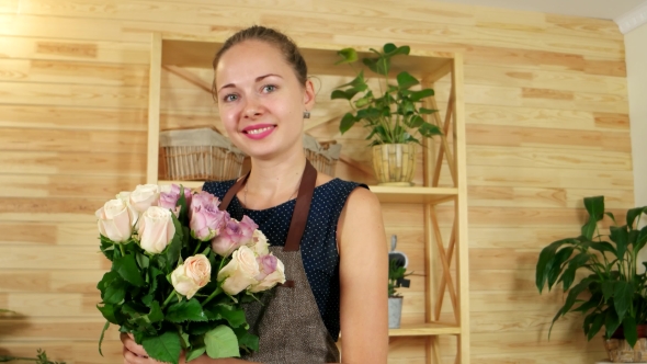 Cute Girl with a Bouquet in Hands, Florist Working in a Flower Shop ...