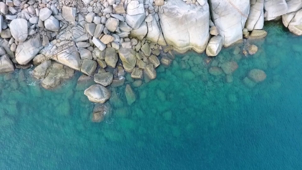 Sea Shore with Big Stones in Blue Sea Water and Green Palm on Rocks ...