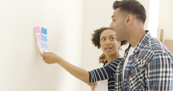 Young Couple Trying To Choose a Paint Color, Stock Footage | VideoHive