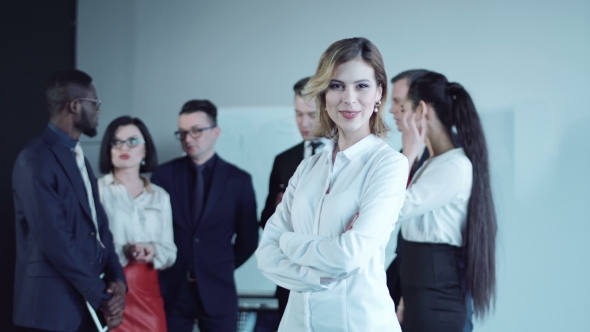 Smiling Woman Looking Back To Colleagues, Stock Footage | VideoHive
