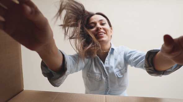 Adorable Woman Taking Out Camera From the Box, Stock Footage | VideoHive