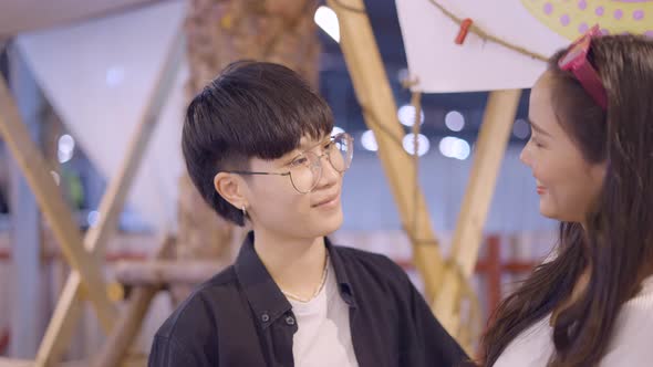 A Girl Wearing Black Shirt is Staring at Her Female Partner in ...