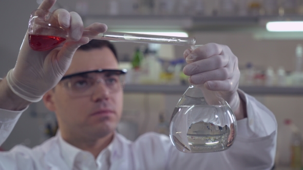 Man Adding Liquid To Glass Bulb., Stock Footage | VideoHive