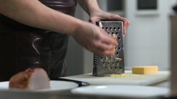 Man Hand Grating Yellow Cheese with a Metal Grater, Stock Footage ...