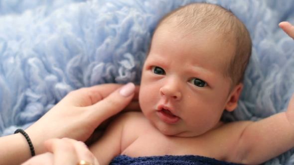 Newborn Wrapped in a Winding Cloth for the Photoshoot, Stock Footage