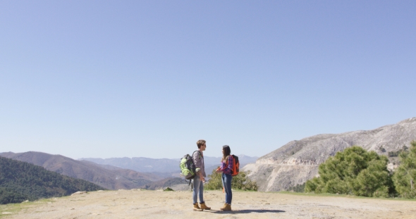 Two People Standing on Mountain Plat, Stock Footage | VideoHive