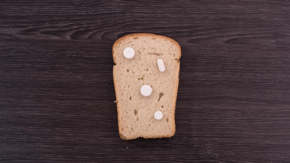 A Piece of Bread with Pills, Stock Footage | VideoHive