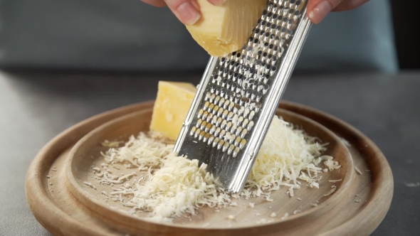 Chef Grates Cheese for Making Pie, Grated Cheese, Dishes From Cheese ...