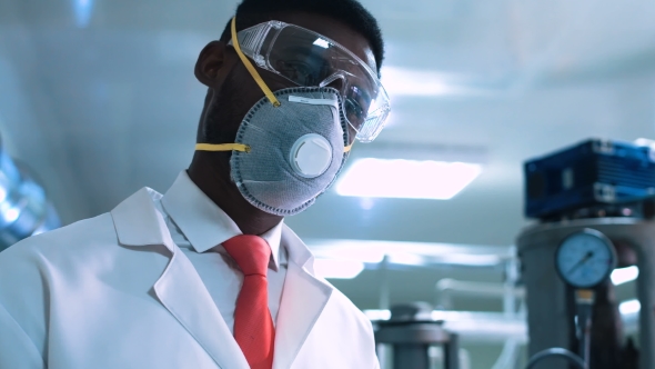 Scientist in Mask Writing in Lab, Stock Footage | VideoHive