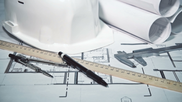 Engineer's Desk with Drawings, Helmet, Ruler, Pencil, Stock Footage
