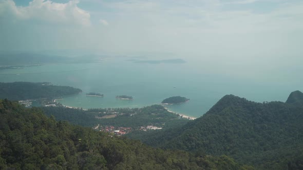 Aerial view of the Andaman sea and a dense tropical forest, Stock Footage