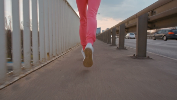 of Girl Runner Jogging on Bridge in the City - Back View, Stock Footage