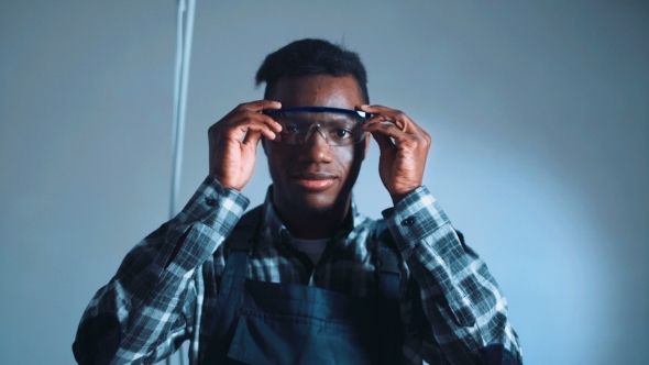 Black Constructor Putting Protective Equipment, Stock Footage | VideoHive