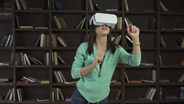 Happy Woman in Vr Headset Touching a Virtual Screen Against Bookshelf ...