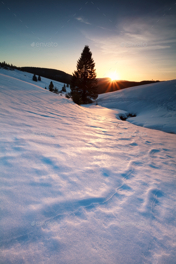 sunset over snowy mountains Stock Photo by catolla | PhotoDune