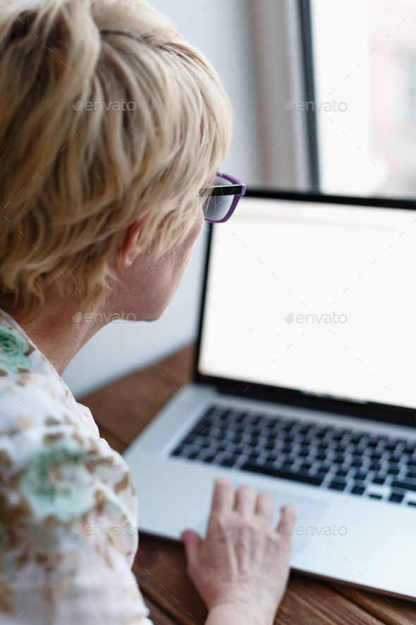 Back view of woman using laptop Stock Photo by KonstantinKolosov ...