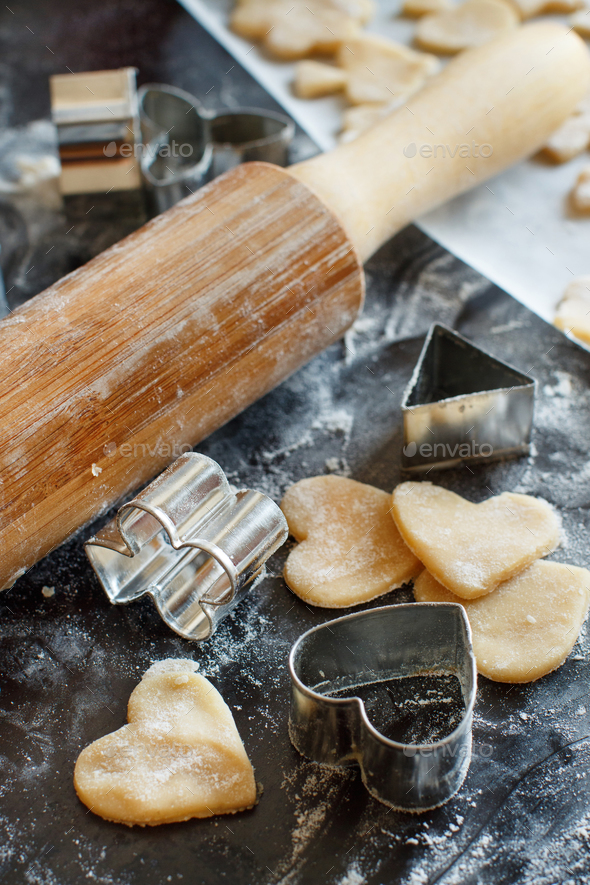 Close up of cookie cutters and rolling pin Stock Photo by katrinshine