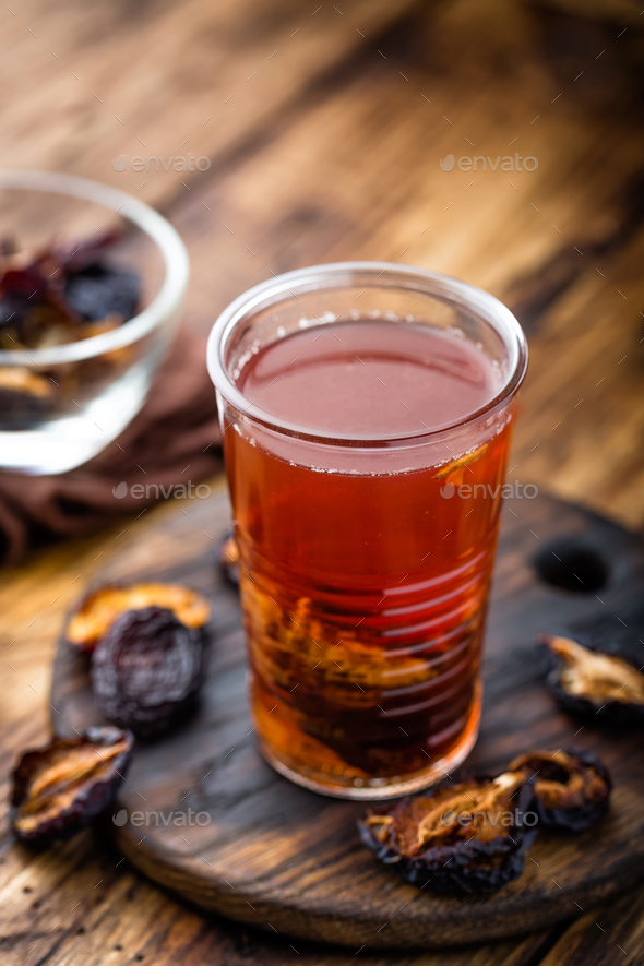 Prune drink, dried plums extract, fruits beverage Stock Photo by sea_wave