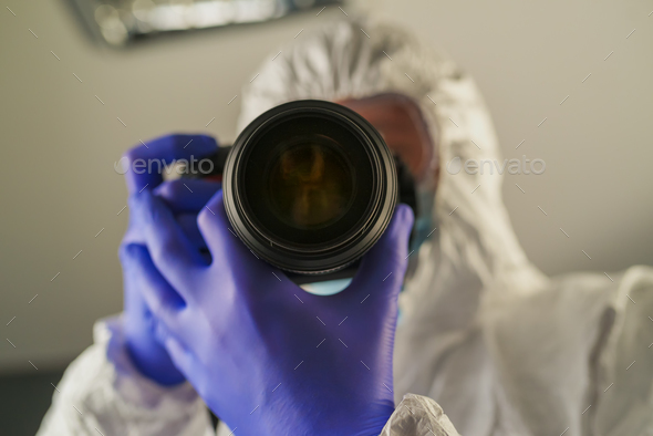 Crime scene forensics investigator with digital camera Stock Photo by ...