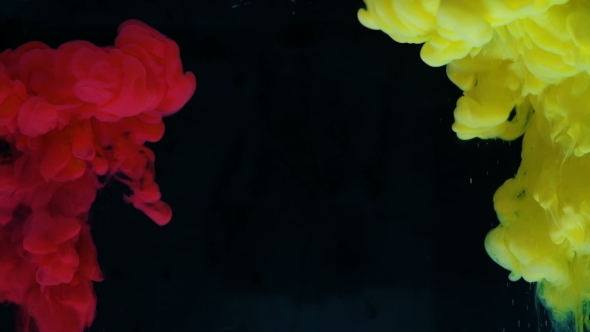 Matte Yellow and Pearlescent Red In in Water Isolated on Black, Stock ...