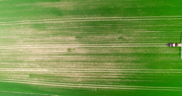 Tractor Fertylizing Field with Chemicals, Stock Footage | VideoHive