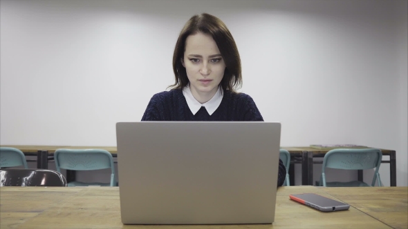 Serious Woman Using a Laptop, Stock Footage | VideoHive