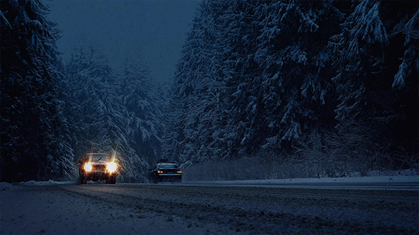 Cars Drive Through Snowstorm In The Evening - Tracking Slowly Sideways ...