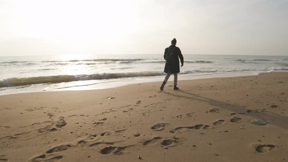 Thoughtful Lone Man Look at Sunrise Wave Ocean Horizon and Throw Stones ...