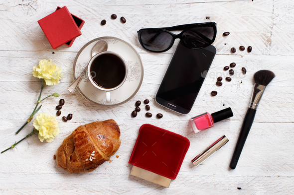 Coffee with croissant and make up tools Stock Photo by katrinshine