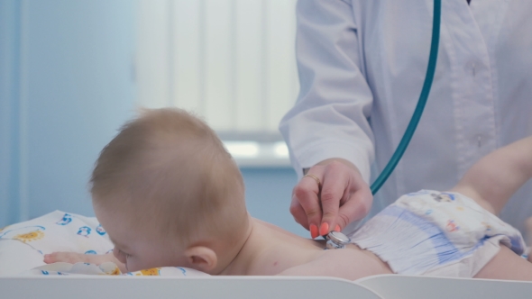 Doctor's Hands Exam the Body of Little Kid with Stethoscope, Stock Footage