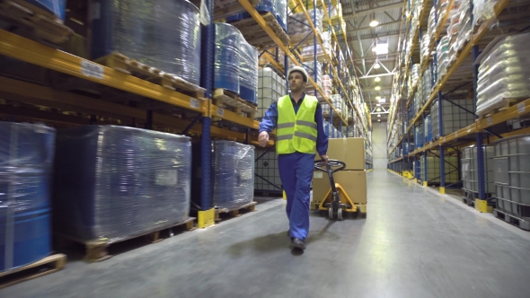 Warehouse Worker Moves Cart with Merchandise, Stock Footage | VideoHive