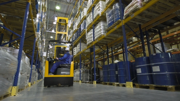 Warehouse Worker on Stacker Loading Cargo on Shelf, Stock Footage ...