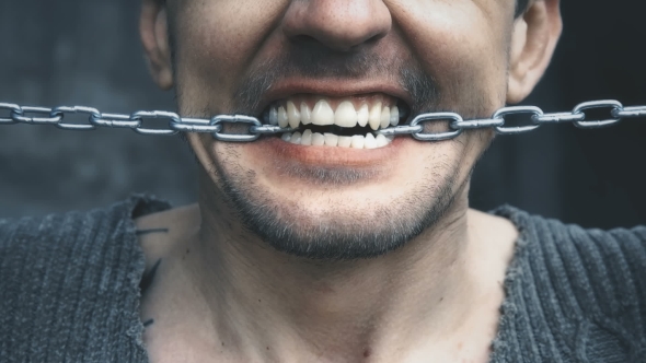 Inmate Bites the Chain of Anger, Stock Footage | VideoHive
